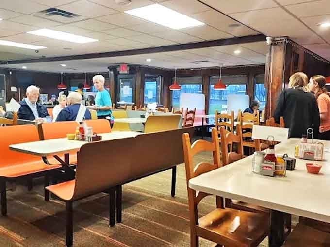 The dining room buzzes with conversation as regulars and newcomers alike share the communal experience of good, honest food.