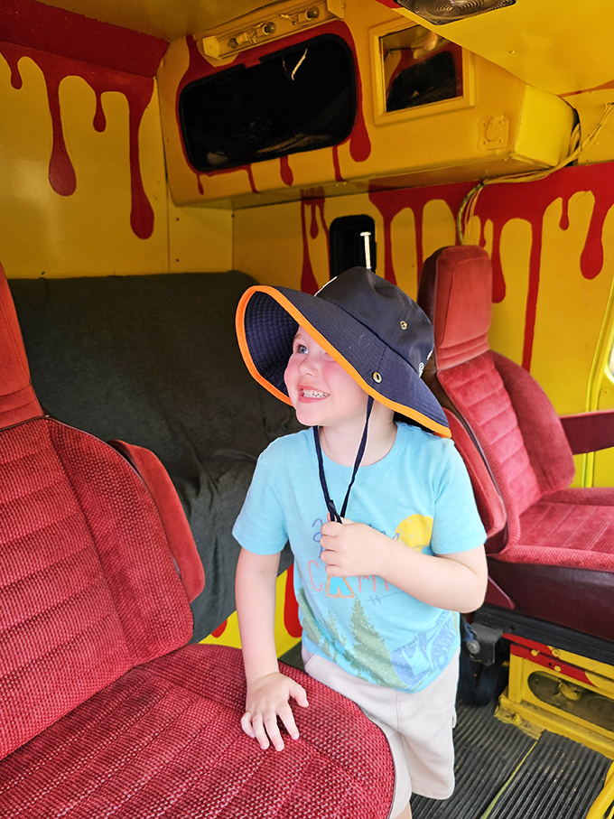 The interior view: where comfort meets chaos with flame-dripping walls and racing seats ready for apocalyptic joy rides.