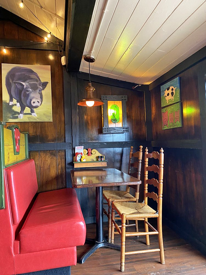 Whimsical pig artwork adorns the wooden walls, adding character and charm to this beloved local tavern.