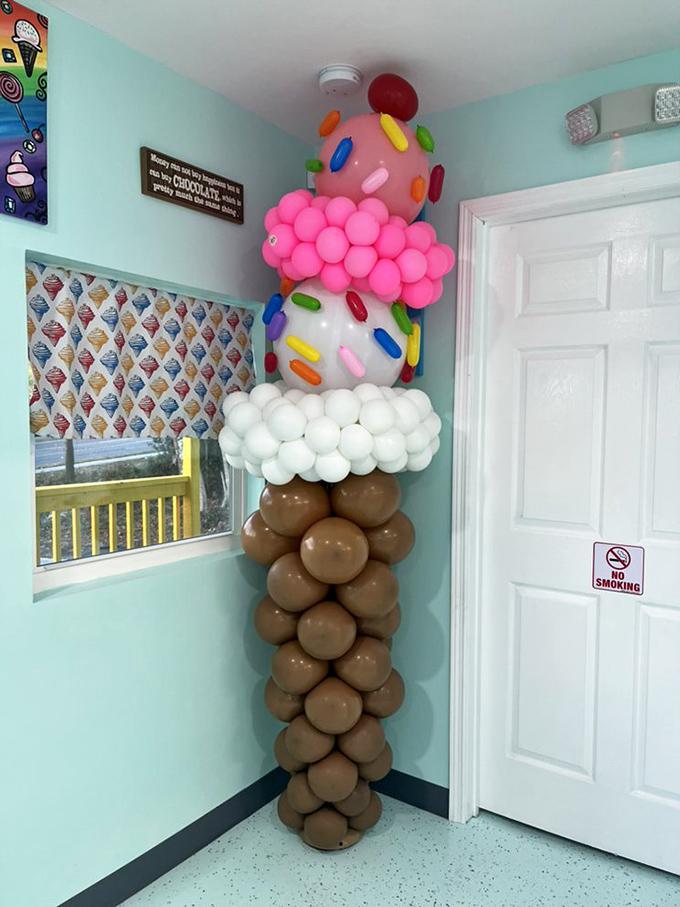 Whimsical ice cream balloon sculpture stands tall in the corner&mdash;a playful reminder of why we're all here.