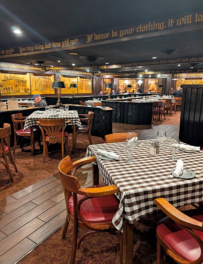 The restaurant's interior features cozy booths and thoughtful divisions that create intimate dining spaces within the historic building's grand architecture.