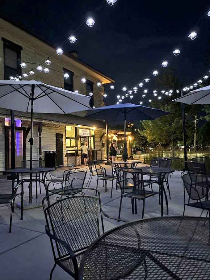 As twilight falls, the patio transforms into a twinkling ice cream sanctuary where strangers become friends over shared flavor recommendations.