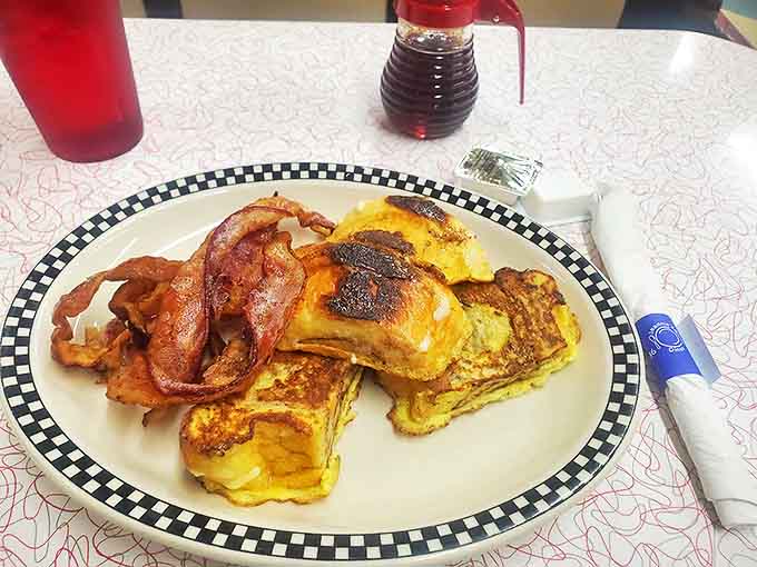Bread that took a bath in cinnamon-vanilla custard before getting the hot griddle treatment &ndash; breakfast or dessert? The line blurs deliciously.