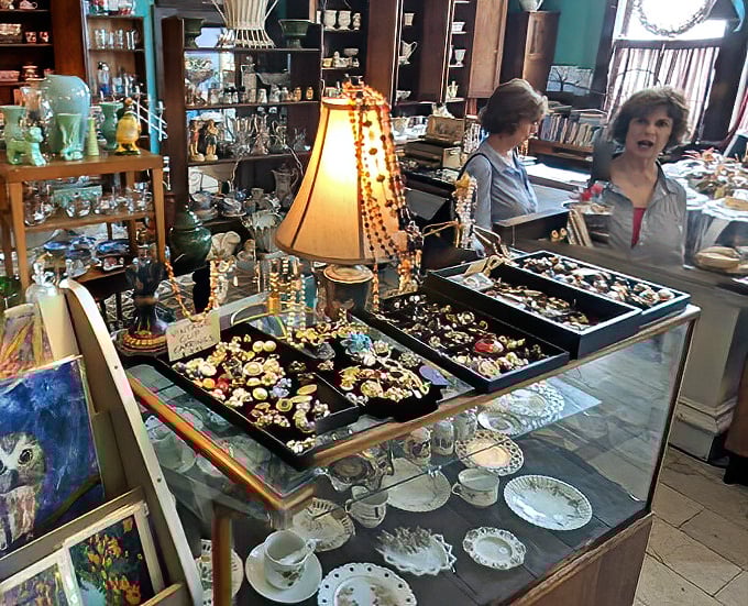 Vintage treasures glimmer under soft lighting, each piece of jewelry telling its own story while customers contemplate which sparkly souvenir to take home.