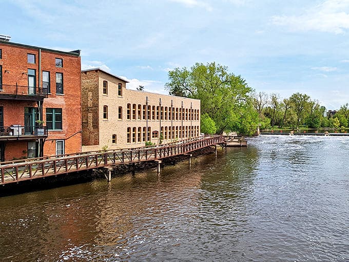 Historic buildings stand sentinel along the riverfront, their brick facades reflecting centuries of stories while embracing modern riverside living.