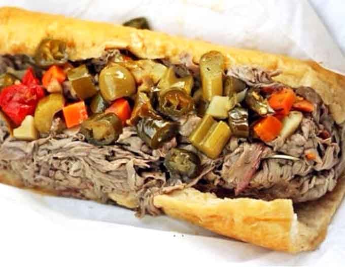 The Italian beef sandwich pays homage to Chicago traditions while fitting perfectly into Lola's diverse menu. Tender meat, giardiniera, and a soft roll create sandwich perfection.