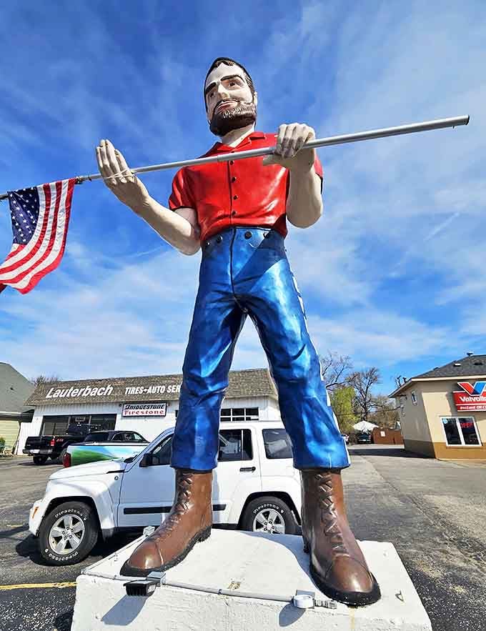 Moss-covered stone walls rise dramatically on both sides, creating cool, shadowy corridors perfect for summer exploration.