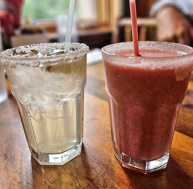 Liquid sunshine in two forms: a classic margarita and its fruity counterpart, both promising to turn an ordinary evening into something special.
