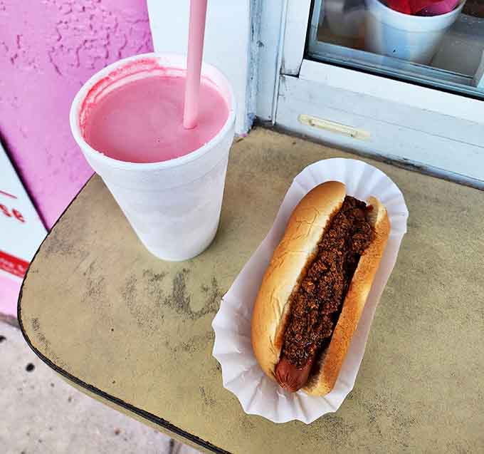 The perfect pairing &ndash; a chili dog for savory satisfaction alongside a strawberry shake for sweet relief, creating the ultimate roadside symphony.