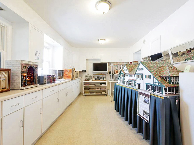 A wooden replica of a Victorian mansion that captures every architectural detail. McMansion? More like McTiny-mansion, and infinitely more charming!