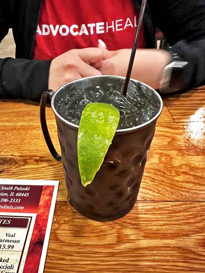The Moscow Mule arrives in its traditional copper mug, condensation beading like jewels &ndash; a refreshing counterpoint to the menu's rich offerings.