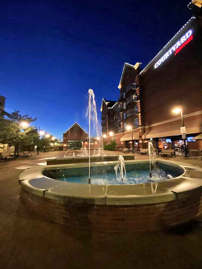 Water dances skyward against the twilight blue, creating the perfect backdrop for those "we should move here" conversations couples have on vacation.