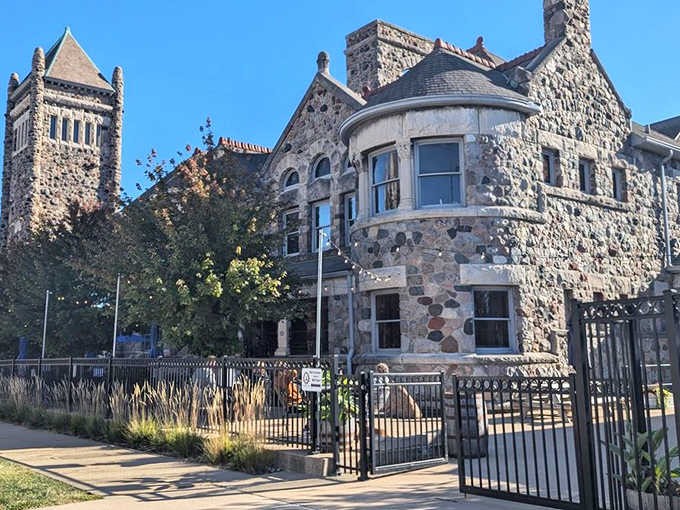 Sunlight plays across the stone facade, highlighting the architectural details preserved in this masterful transformation from sacred to social space.