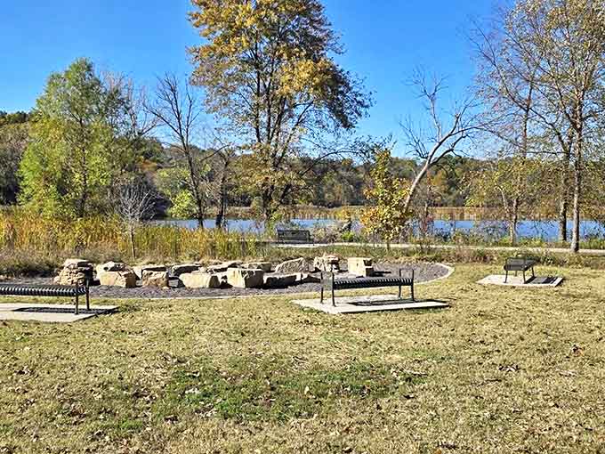 Stone seating circles a gathering area where stories are shared and memories made under the watchful gaze of ancient oaks.