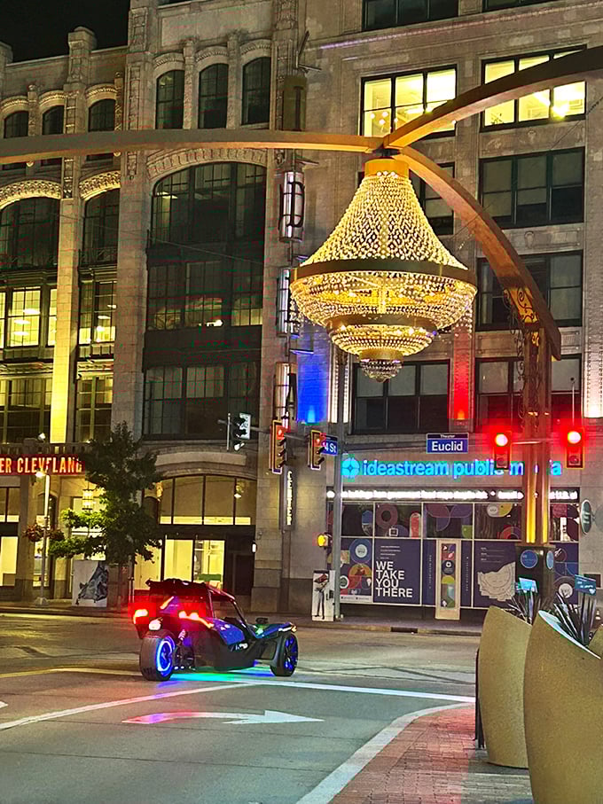 Even exotic vehicles like this Polaris Slingshot seem right at home under the chandelier's glow, where everyday streets feel like movie sets.
