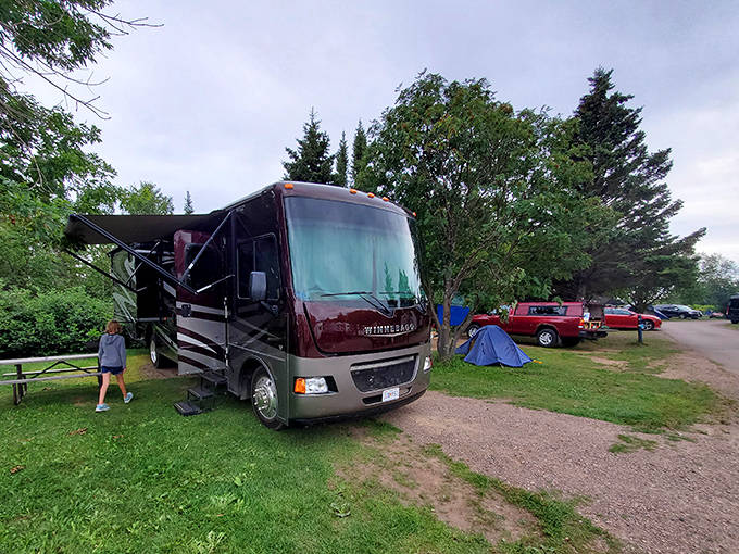 RV enthusiasts find their perfect parking spot at Grand Marais Tourist Park, where morning coffee comes with a side of spectacular lake views.
