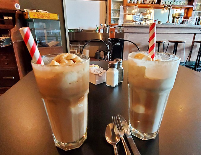 The classic American duo &ndash; root beer floats served in tall glasses with those signature striped straws promise fizzy, creamy nostalgia in every sip.