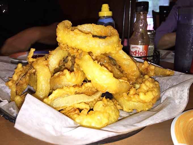 These beer-battered onion rings achieve golden, crispy perfection, making them dangerously addictive and absolutely worth the inevitable onion breath.