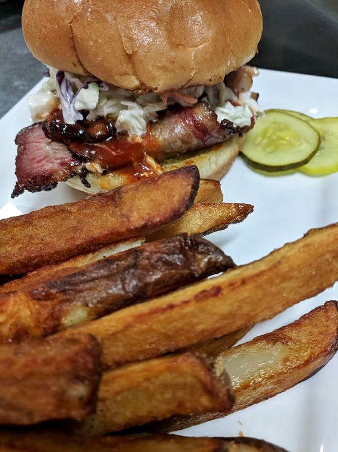 A slow-smoked brisket sandwich that makes you question why you ever eat anything else &ndash; tender, flavorful meat on a proper bun.