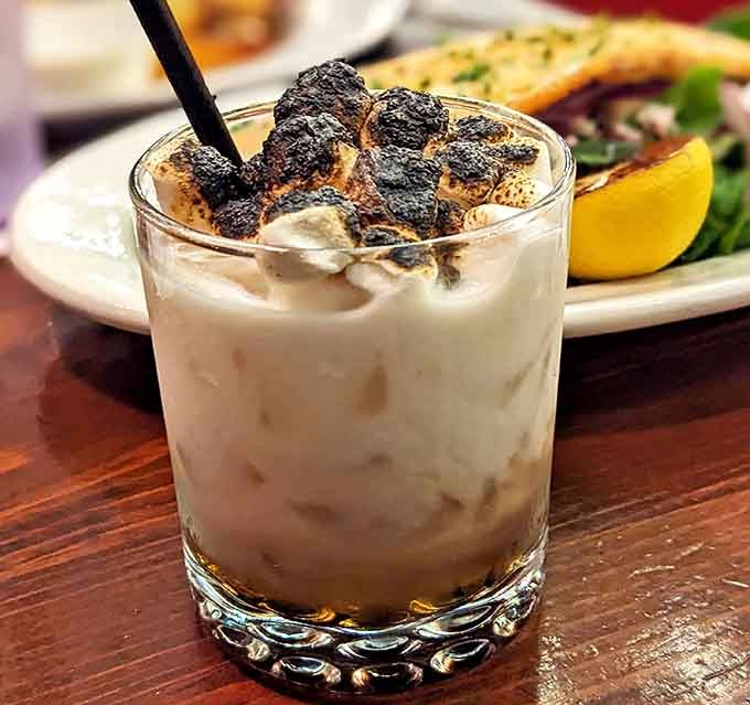 The S'mores Campfire Cocktail brings childhood nostalgia to adult beverages, complete with toasted marshmallows and a creamy, indulgent base.