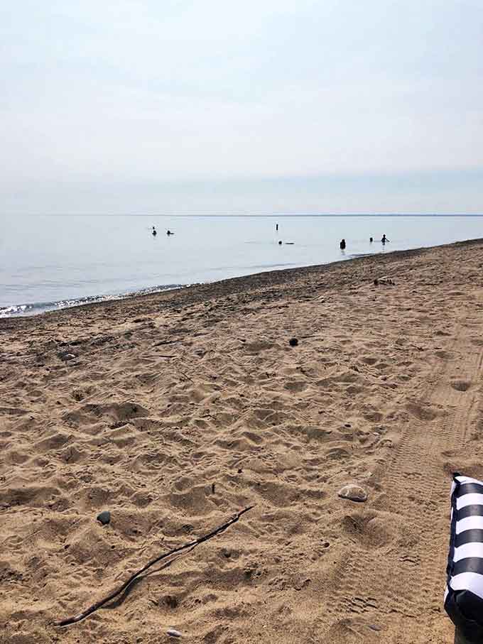 Footprints in the sand tell stories of beachcombers and wave-chasers enjoying Michigan's answer to oceanfront property.