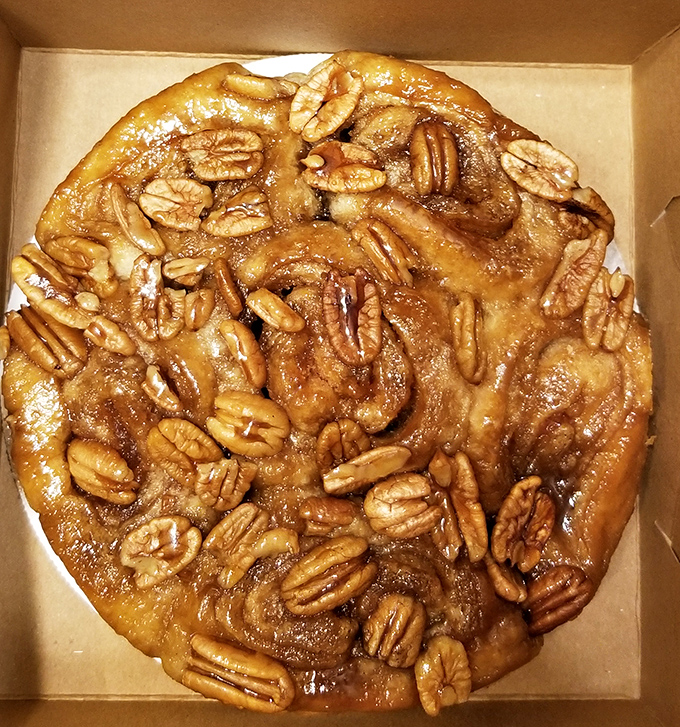 A sticky, nutty masterpiece that laughs in the face of dainty desserts – this caramel pecan creation demands both hands and napkins.