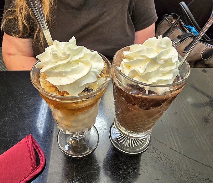 These aren't just desserts; they're ice cream skyscrapers where hot fudge rivers cascade down vanilla mountains topped with whipped cream clouds.
