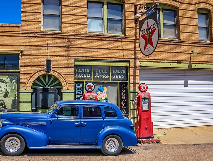 Texaco's iconic star shines bright against the weathered brick, a beacon for motorists from another era.