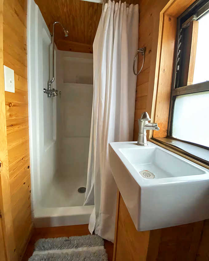 The shower stall might remind you of compact quarters, but the hot water and clever design make freshening up a delightful novelty.