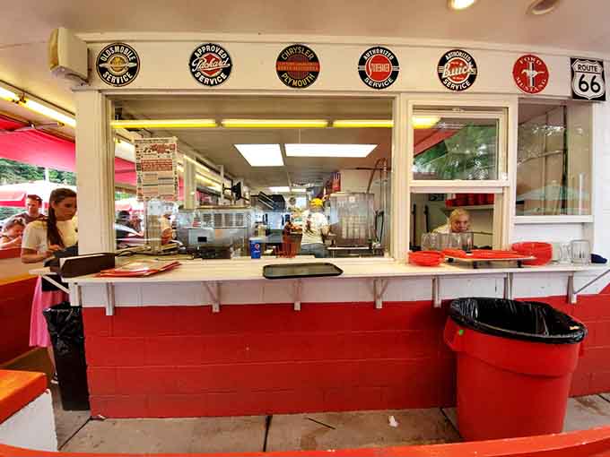 The order window where magic happens, carhops collecting orders before skating them out to hungry customers waiting in anticipation.