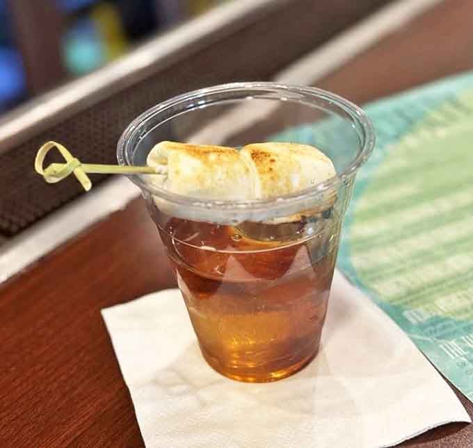 The Toasted Marshmallow Old Fashioned arrives with its namesake garnish, infusing the classic cocktail with campfire sweetness.