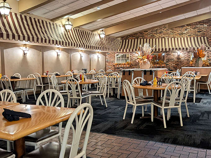 The striped awnings and brick walls create that classic diner feel where comfort food reigns supreme and everyone leaves happier than they arrived.