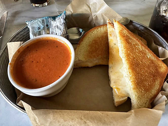 Nothing beats the simple pleasure of grilled cheese and tomato soup, especially when the bread is perfectly buttered and the soup rich and velvety.