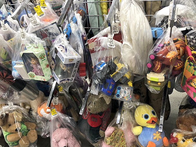 Bagged stuffed animals peer hopefully through plastic, like adorable inmates dreaming of adoption and cuddle parole.
