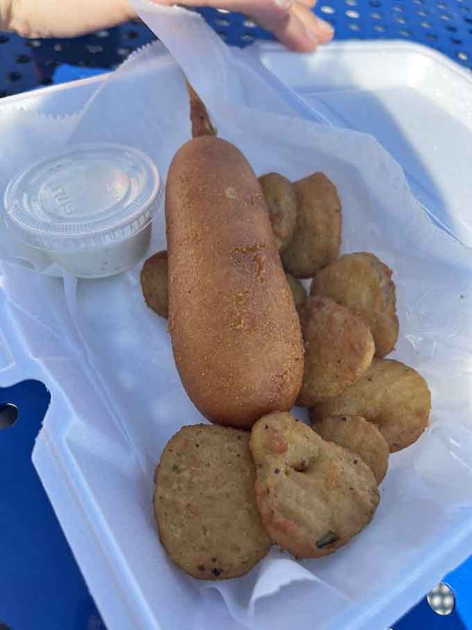 A corn dog and fried pickles walk into a diner, and suddenly you understand why carnival food tastes better when it's made right.