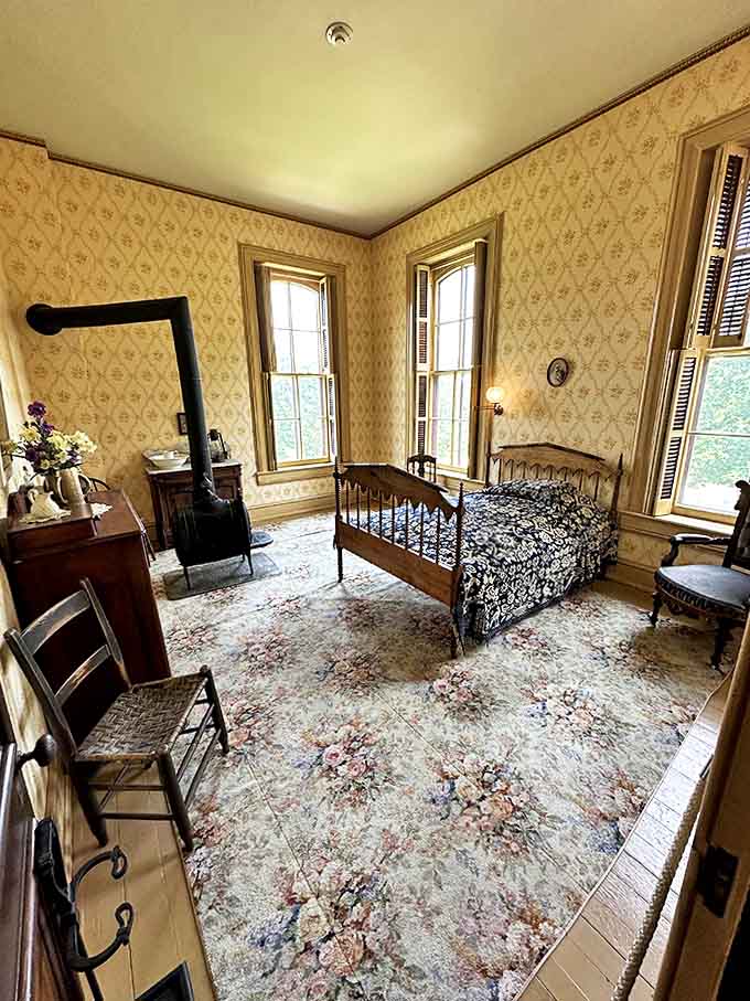 This guest bedroom, with its period-perfect furnishings and floral carpet, offered visitors the 19th-century equivalent of a five-star hotel experience.