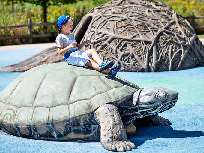 Visitor: Childhood joy meets giant turtle sculpture in a moment that perfectly captures why we need more outdoor play and fewer video games.