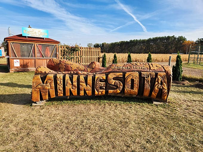 The hand-carved Minnesota sign welcomes visitors with artistic flair that would make any woodworker jealous of the craftsmanship displayed.
