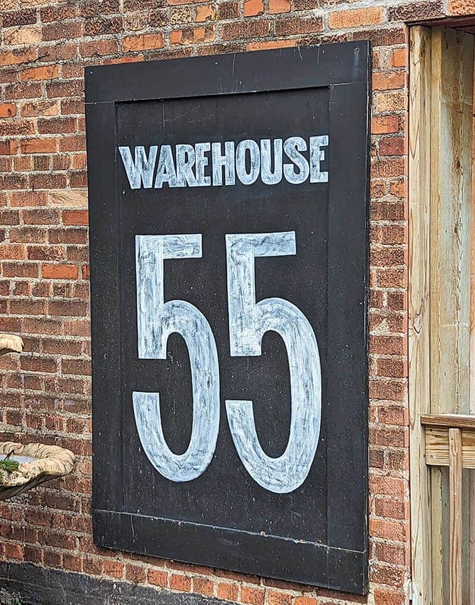 The bold signage against weathered brick tells you exactly where you are and promises vintage treasures worth the visit today.