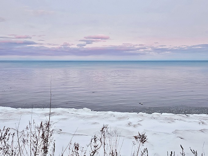 Winter transforms the schoolhouse into a snow-globe-worthy scene, promising warm comfort food inside those historic walls.