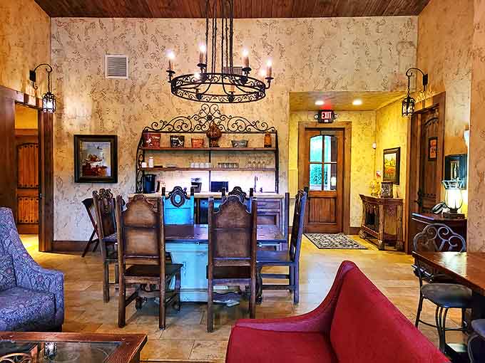 Rustic elegance defines this dining space where wooden beams and wrought iron chandeliers set the stage for memorable meals and better conversations.