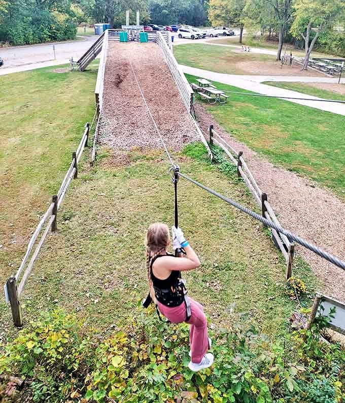 The ultimate leap of faith: a participant embraces the exhilarating freedom of ziplining across the forest canopy with nothing but air below.