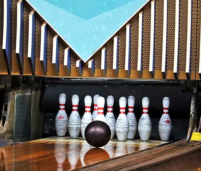 That magical moment when the ball meets the pins &ndash; simple physics creating pure joy since bowling began.
