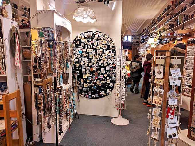 A jewelry wonderland awaits in this corner of the shop, where necklaces and pins from different eras create a timeline of accessory evolution.