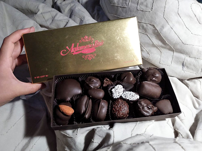 A golden box reveals chocolate treasures within &ndash; handcrafted confections that make standard candy bars seem like distant, inferior relatives.