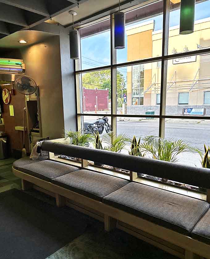 Sunlight streams through lobby windows, creating a moment of tranquility before the cinematic journey begins.