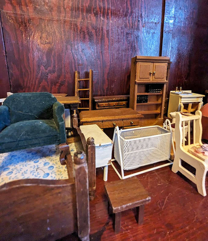 Miniature furniture pieces create a dollhouse-like display, tiny architectural elements that mirror their full-sized counterparts with surprising detail and craftsmanship.