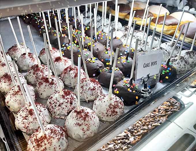 Cake pops stand at attention like tiny dessert soldiers, each one a perfect single-serving indulgence on a convenient stick.