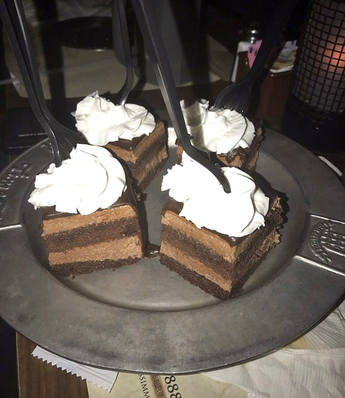 Decadent chocolate cake squares topped with whipped cream – because even knights need a sugar rush after all that jousting.