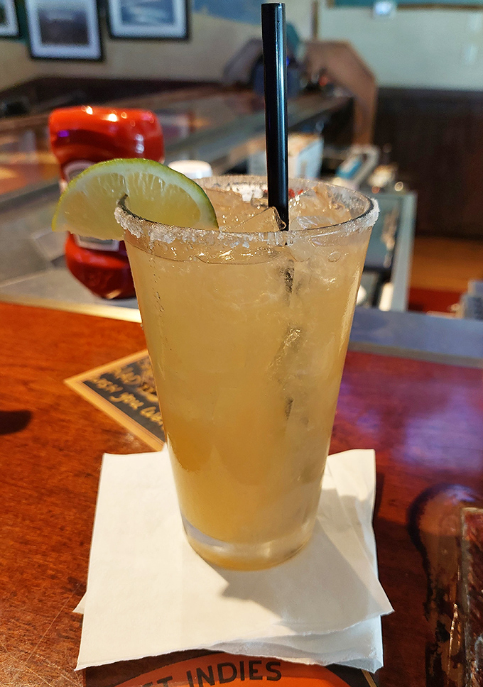 This margarita's salt rim and lime wedge frame a perfectly balanced tequila experience &ndash; present but not trying to be the star of the show.